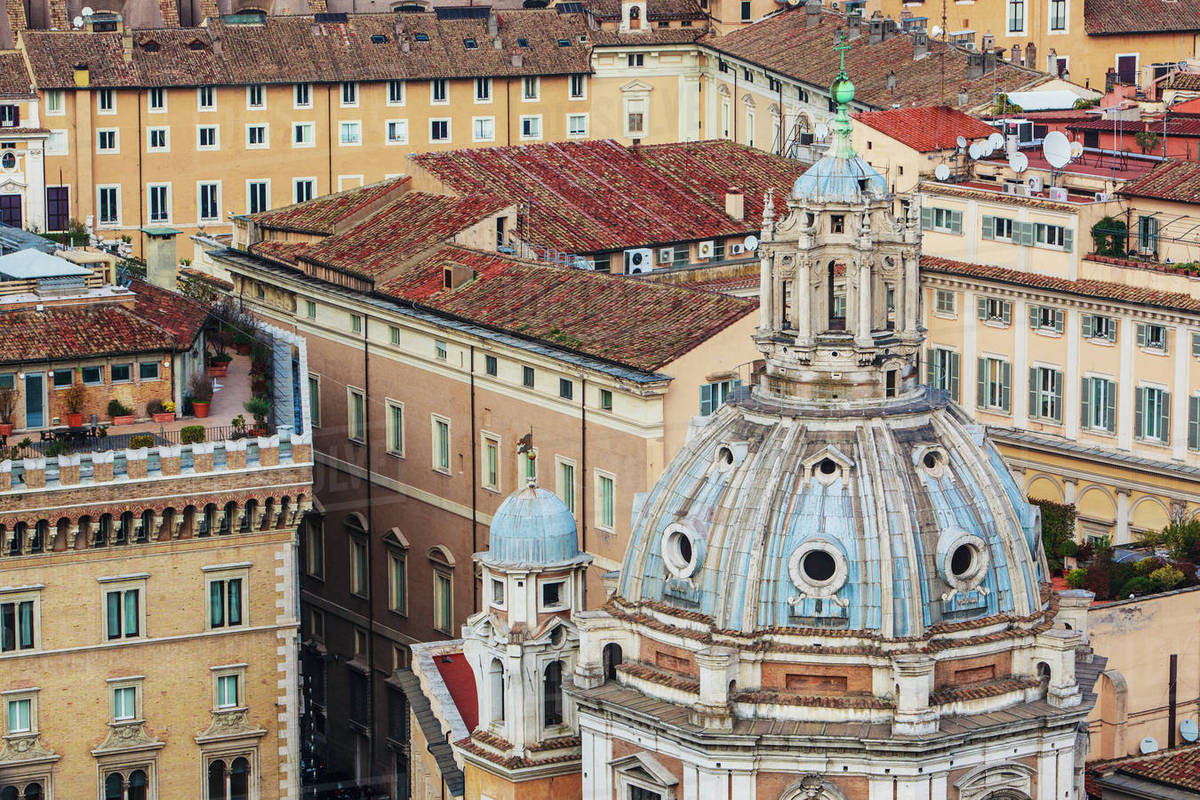 Dome Of Church Roof With Cross And Various Other Buildings; Rome, Italy ...