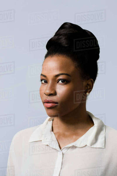 Close Up Portrait Of An African Canadian Woman Against Blue Wall ...