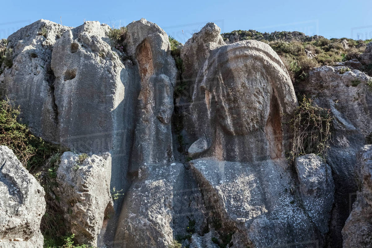 Carving In A Rugged Rock Cliff; Antioch, Turkey - Stock Photo - Dissolve