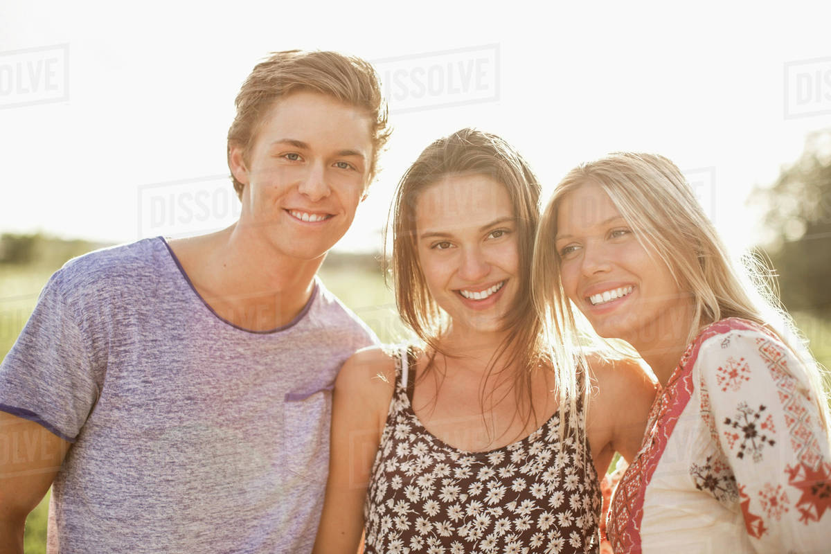 Portrait of young friends smiling outdoors - Royalty-free Stock Photo ...