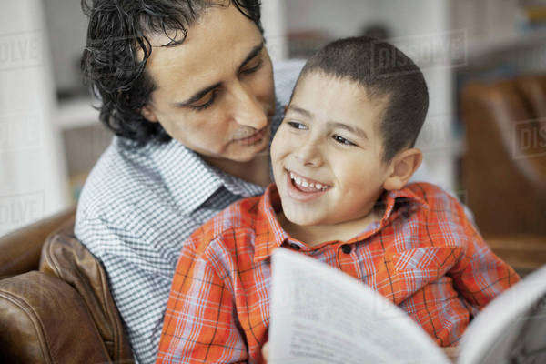Father and son studying at home - Royalty-free Stock Photo | Dissolve
