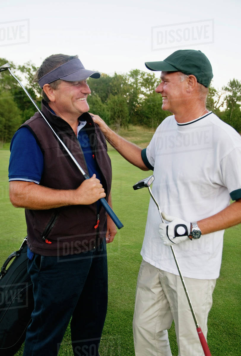 Men playing golf - Royalty-free Stock Photo | Dissolve
