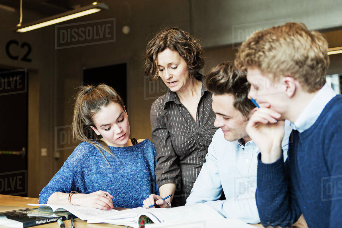 Professor teaching students in classroom - Royalty-free Stock Photo ...