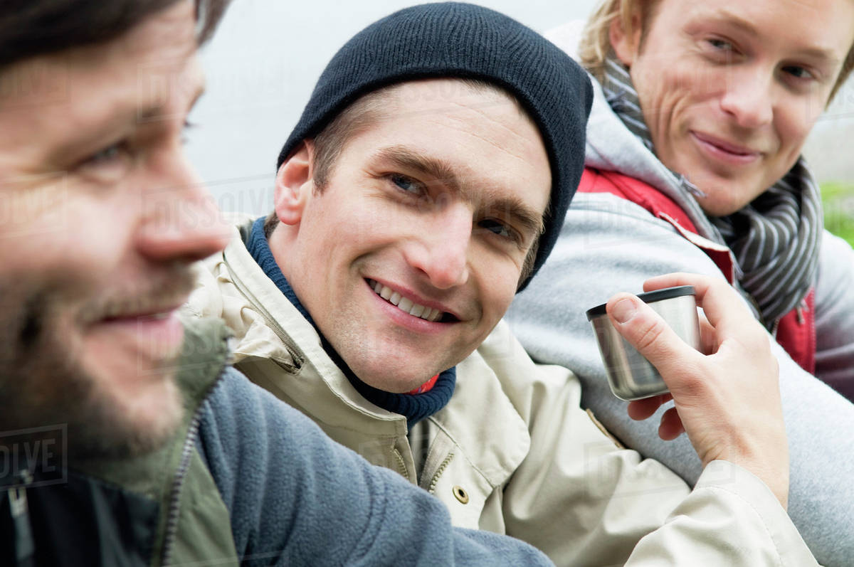 Three guys in a row - Royalty-free Stock Photo | Dissolve