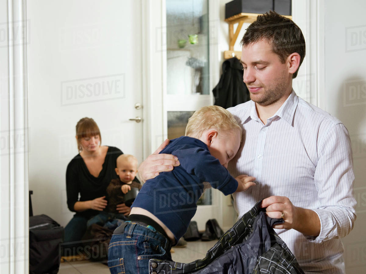 Family getting ready to go out - Stock Photo - Dissolve