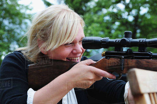 Woman with rifle - Stock Photo - Dissolve