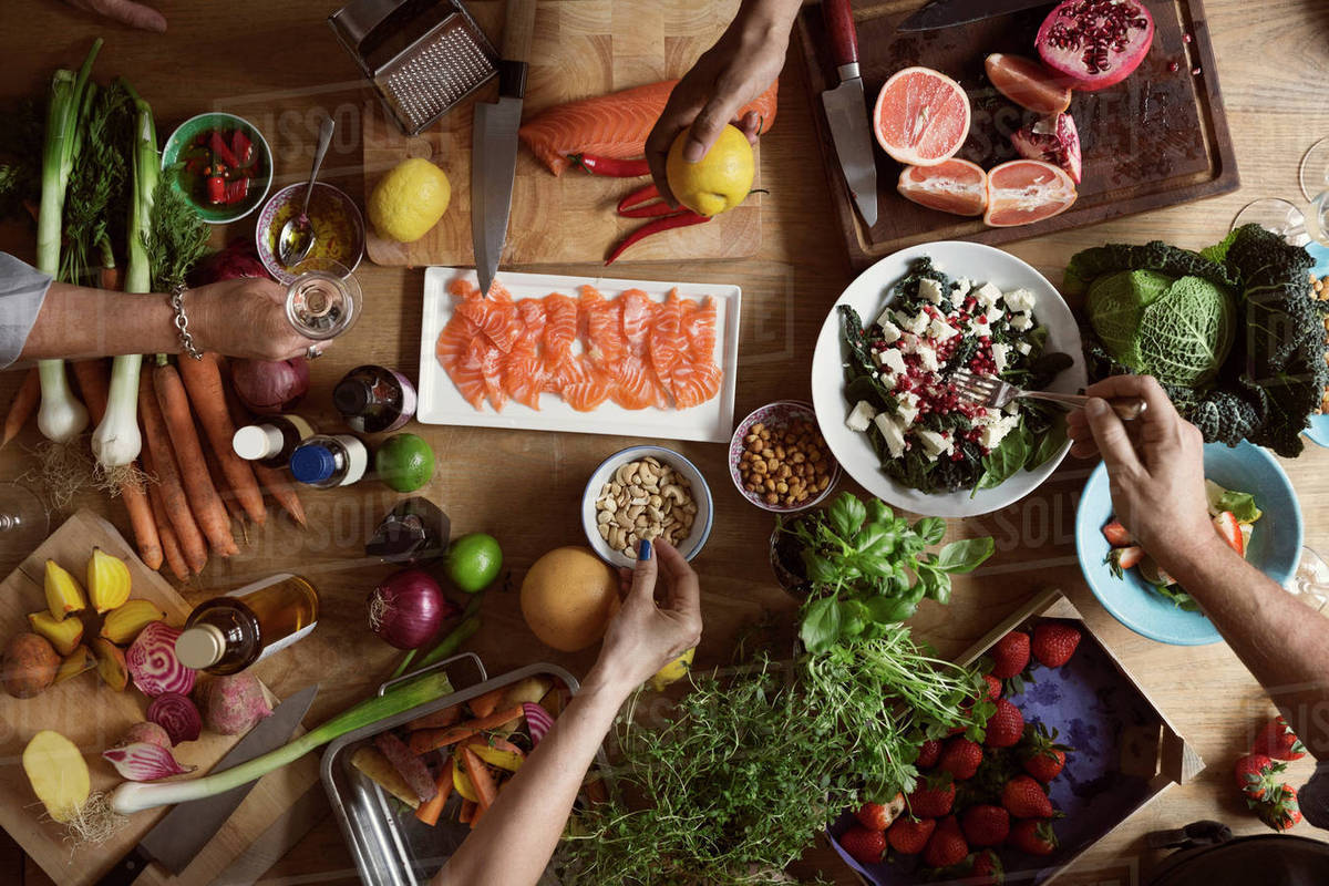 Cropped image of hands preparing food on table - Royalty-free Stock ...