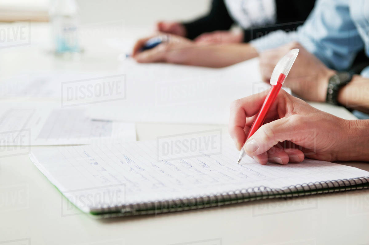 Person taking notes - Stock Photo - Dissolve
