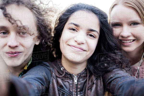 Portrait of smiling friends - Stock Photo - Dissolve