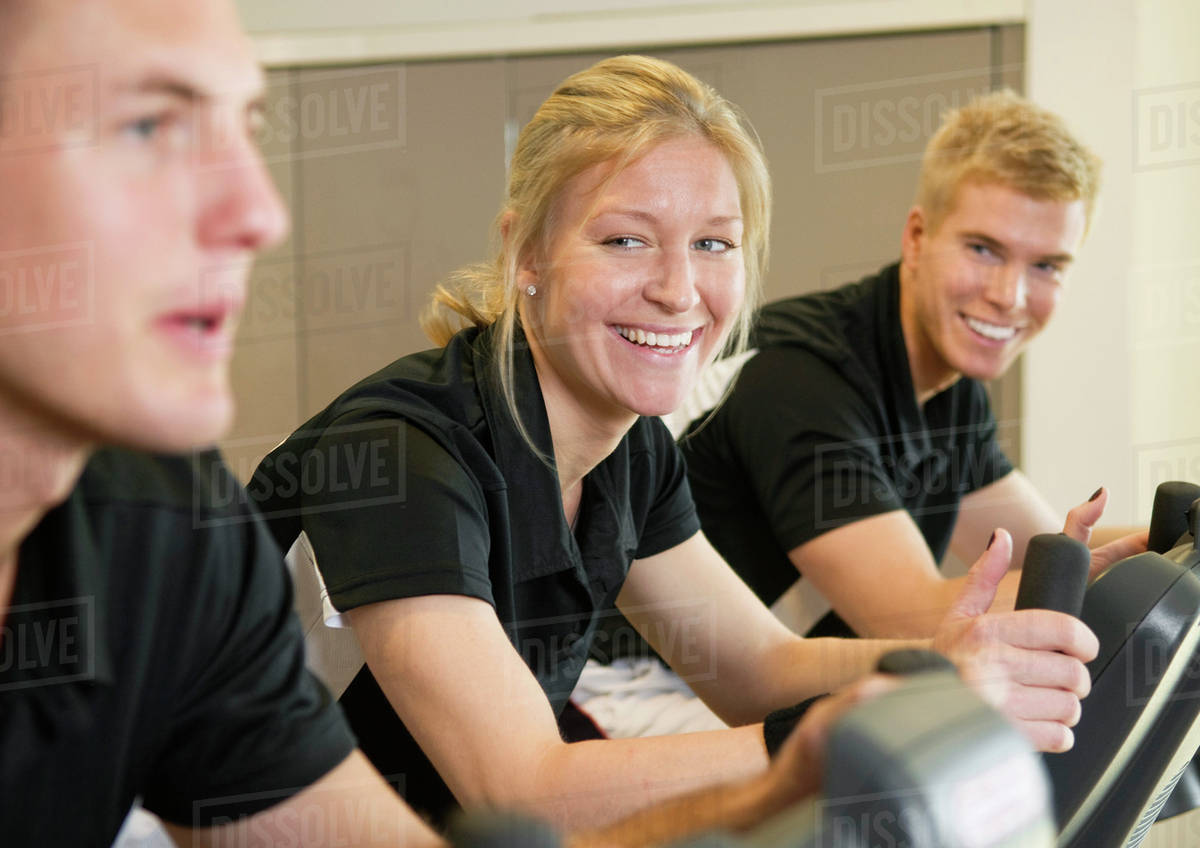 Three friends working out - Stock Photo - Dissolve