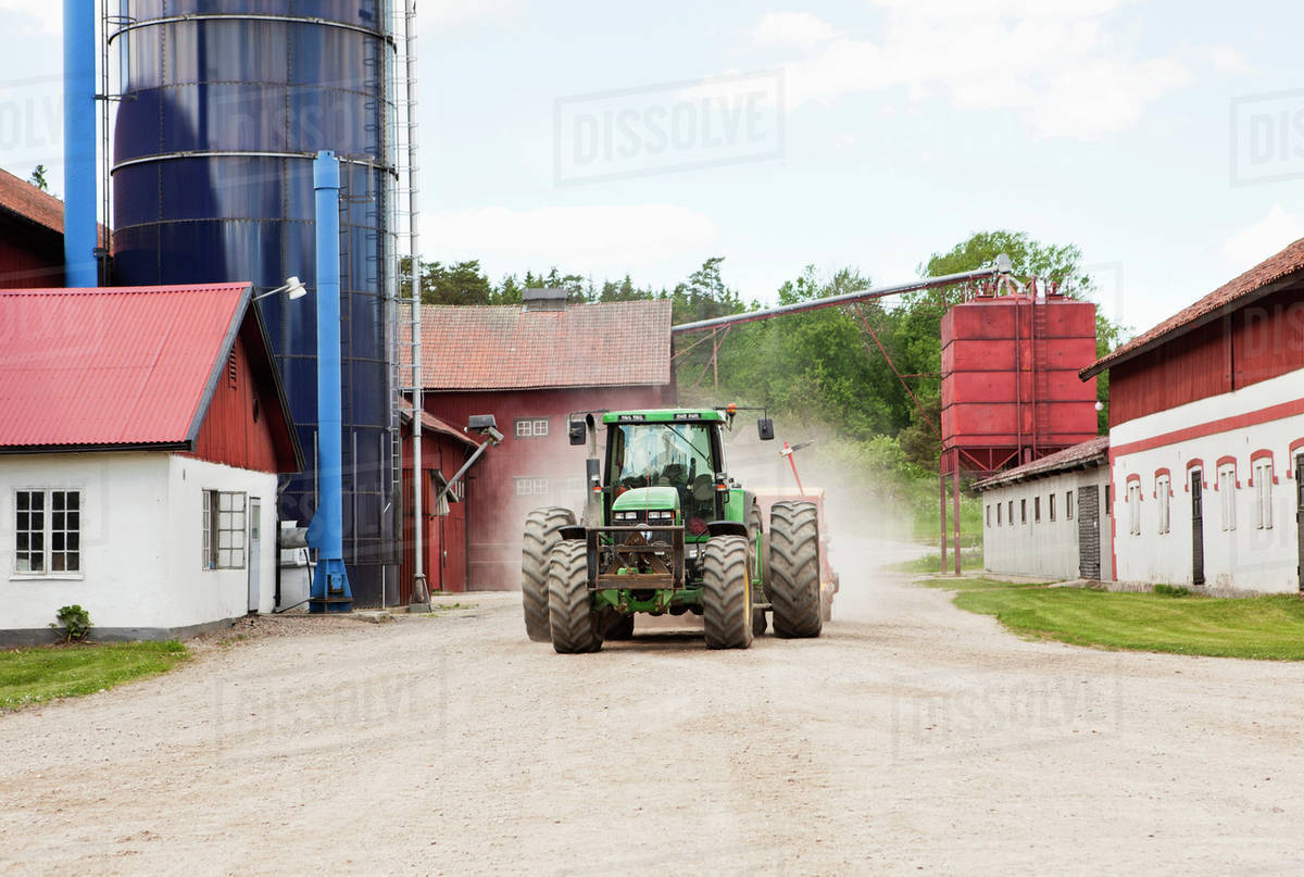 Tractor in farmyard - Stock Photo - Dissolve