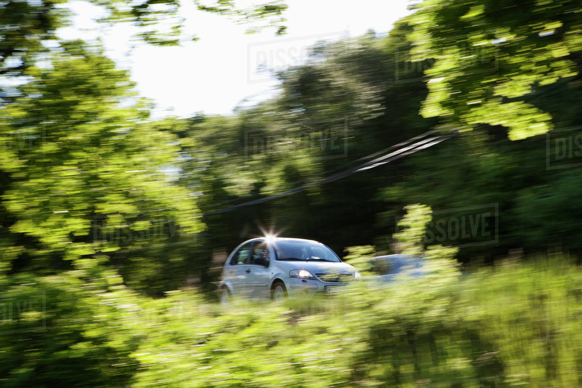 Car driving in forest - Royalty-free Stock Photo | Dissolve
