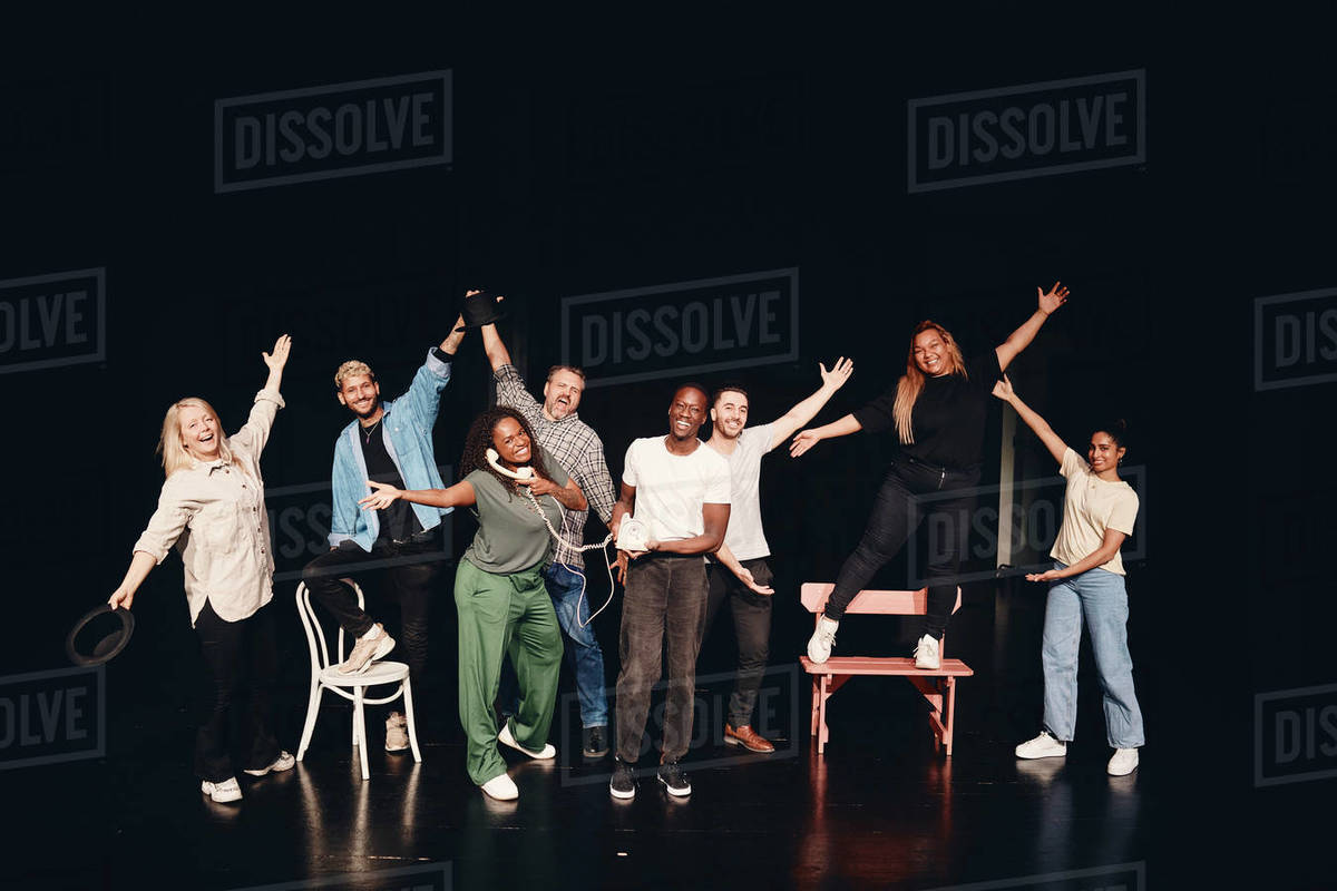 Full length portrait of happy artists together on stage - Stock Photo ...