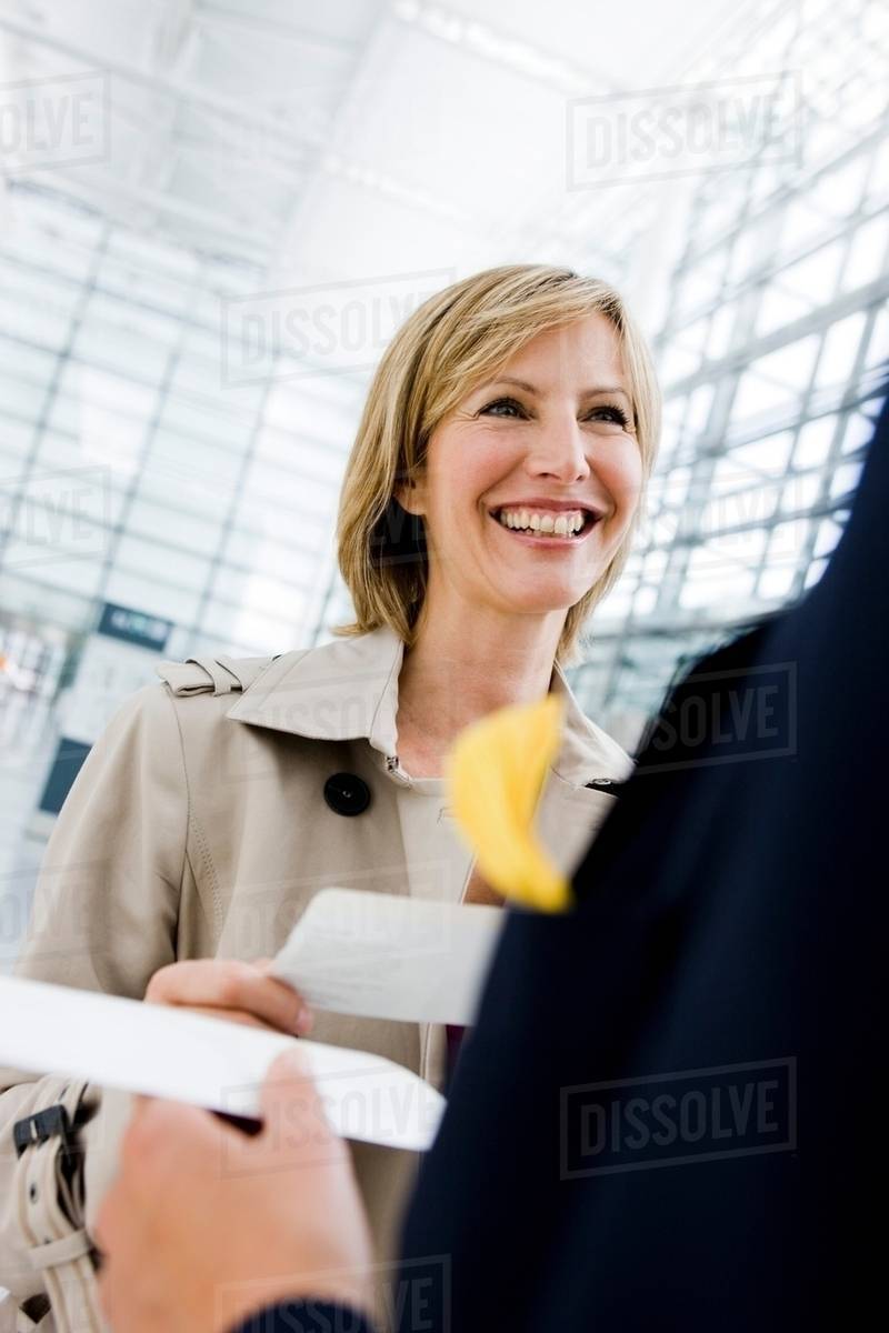 Woman checking in - Royalty-free Stock Photo | Dissolve