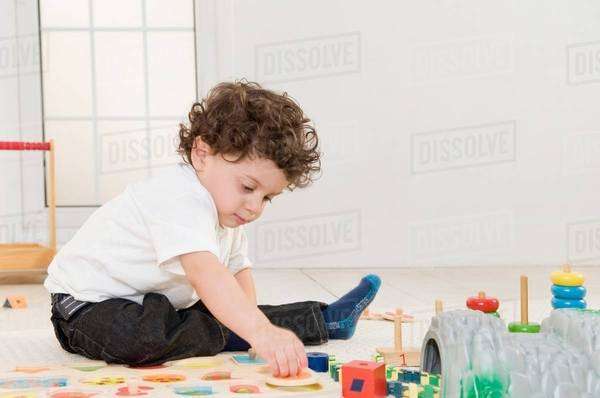 A boy playing with his toys - Royalty-free Stock Photo | Dissolve