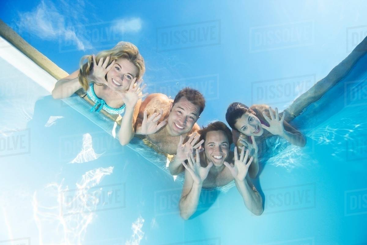 Group of friends in pool - Royalty-free Stock Photo | Dissolve