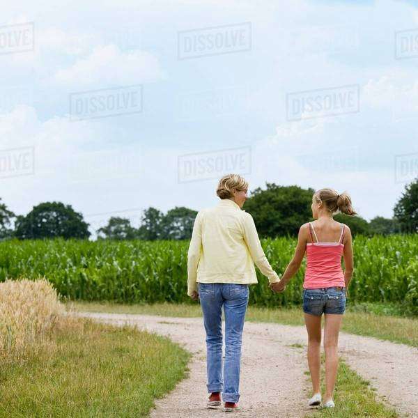 Woman and girl taking a walk - Stock Photo - Dissolve