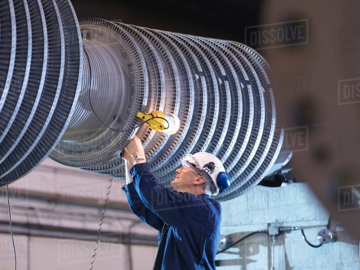 Engineer Working On Turbine - Stock Photo - Dissolve