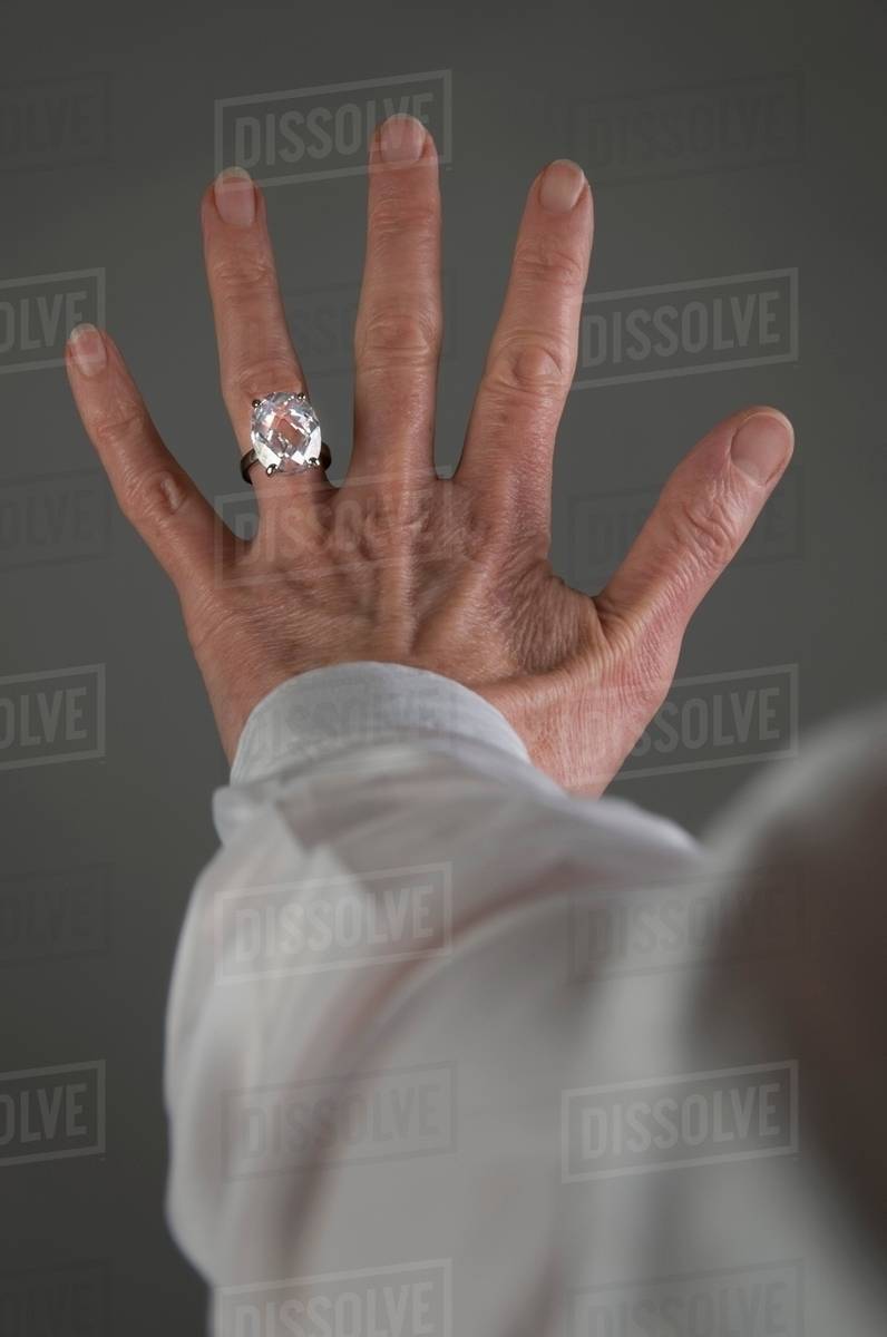 Female hand with diamond ring - Stock Photo - Dissolve