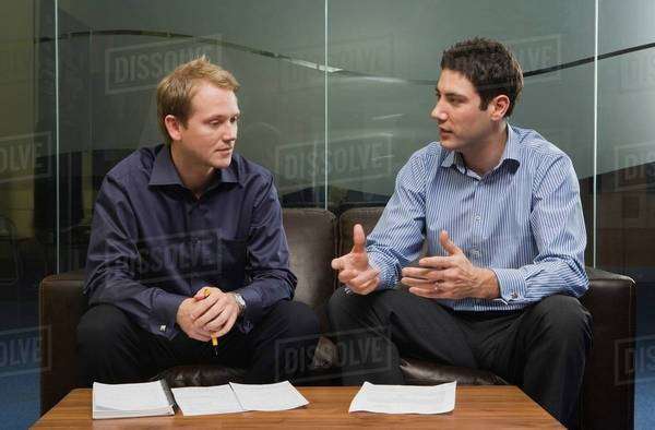Two men having discussion - Royalty-free Stock Photo | Dissolve