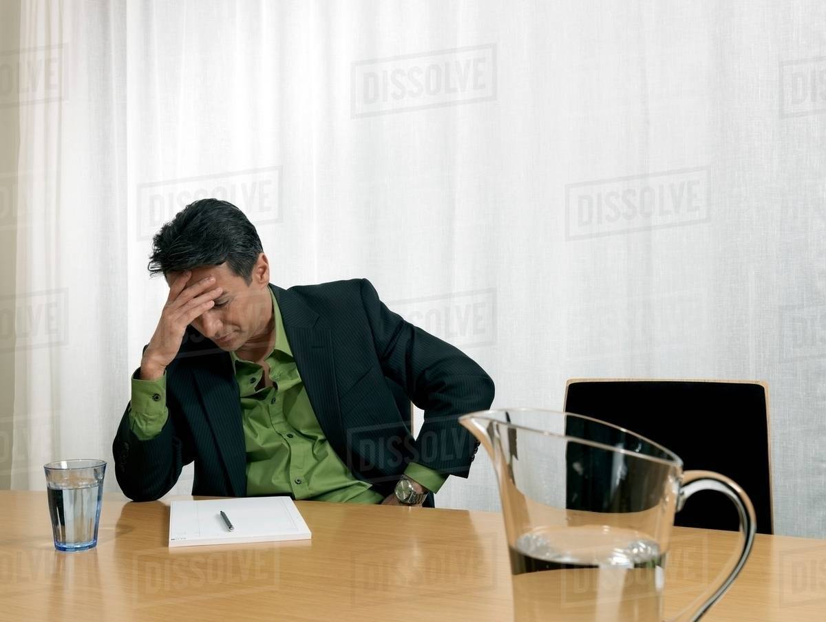 Business man conference table - Royalty-free Stock Photo | Dissolve