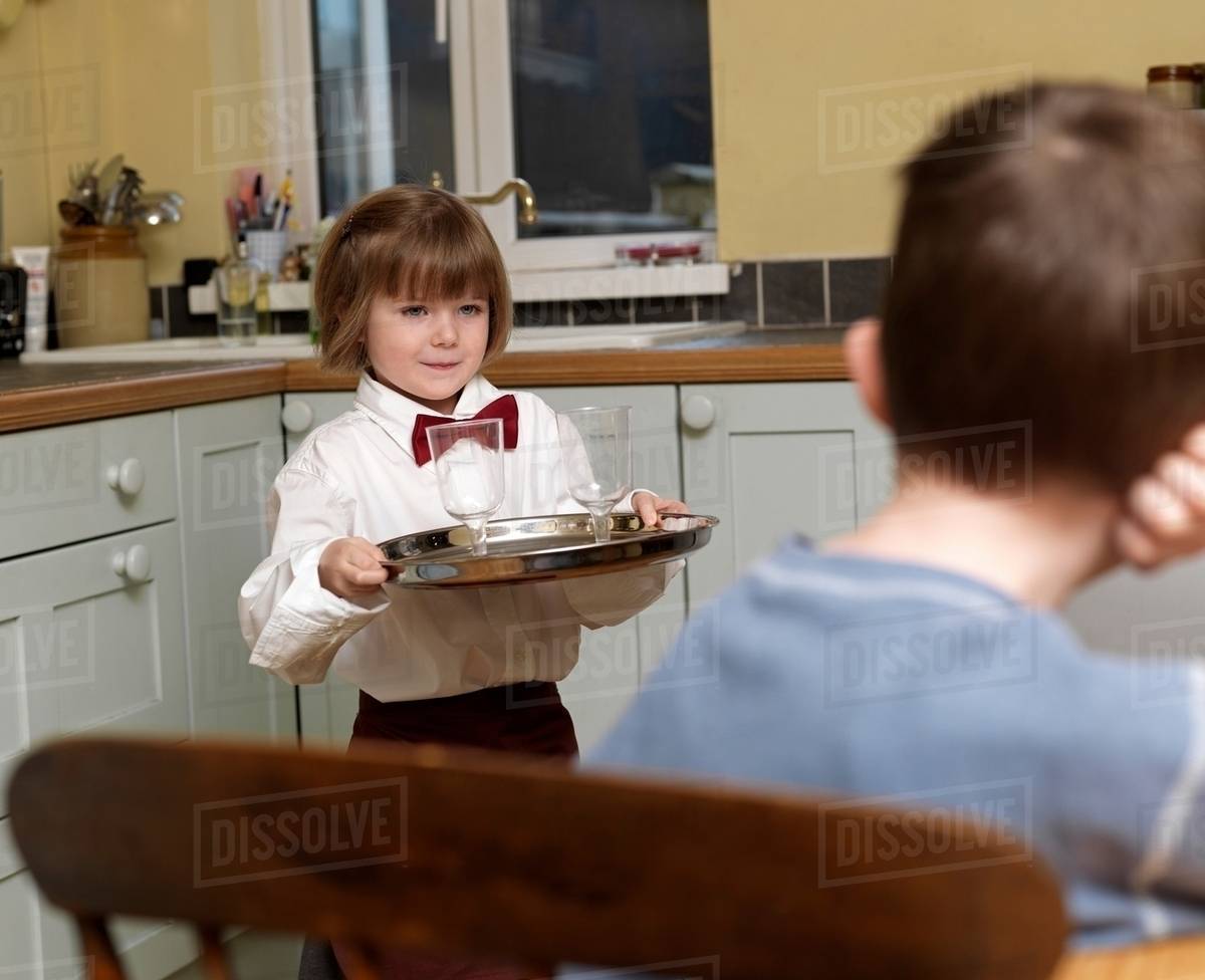 Girl dressed as waitress - Royalty-free Stock Photo | Dissolve