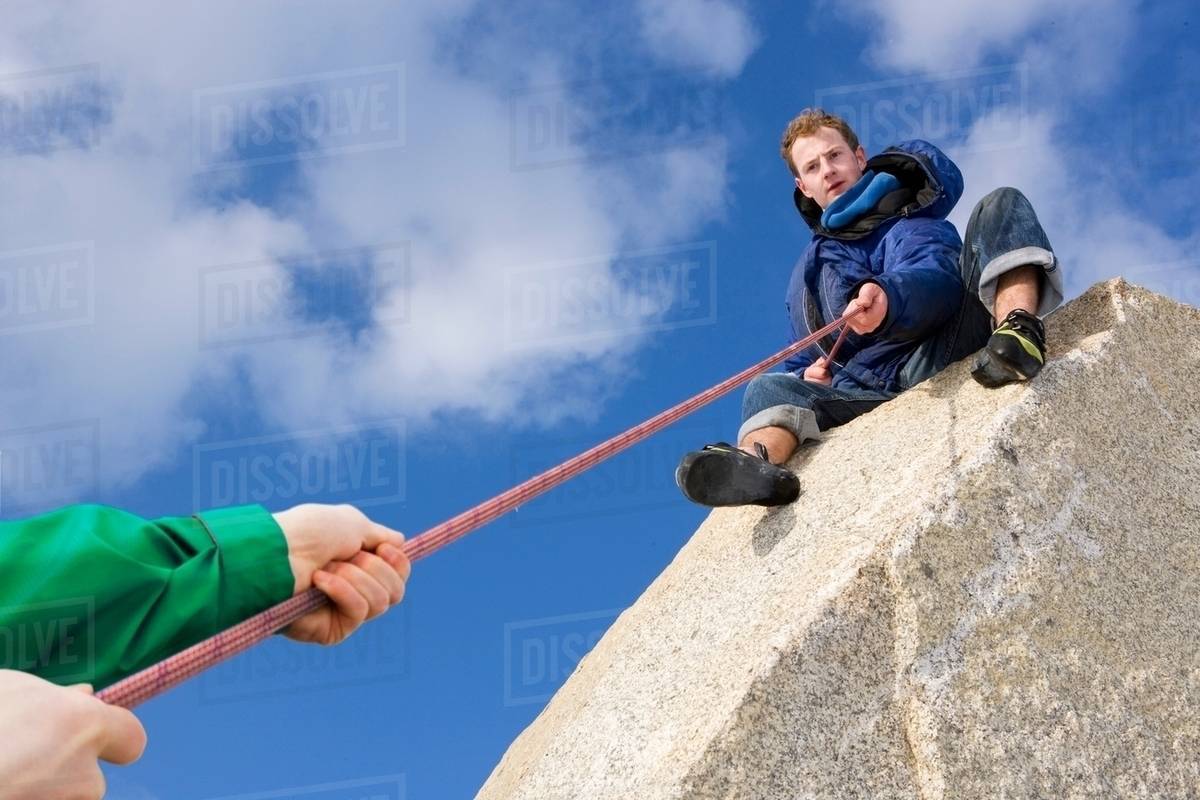 Climber belaying fellow climber - Royalty-free Stock Photo | Dissolve