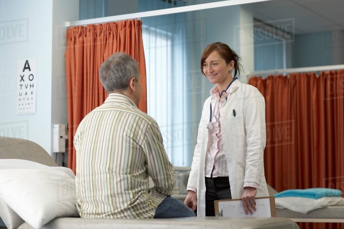Doctor talking to patient - Royalty-free Stock Photo | Dissolve