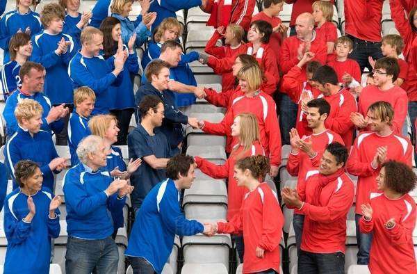 Rival fans at football match - Royalty-free Stock Photo | Dissolve