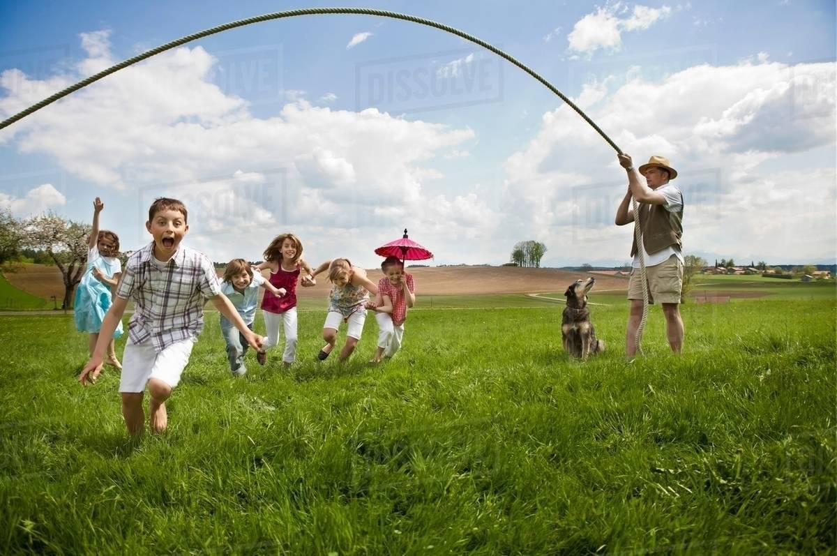 Family having fun in countryside - Royalty-free Stock Photo | Dissolve