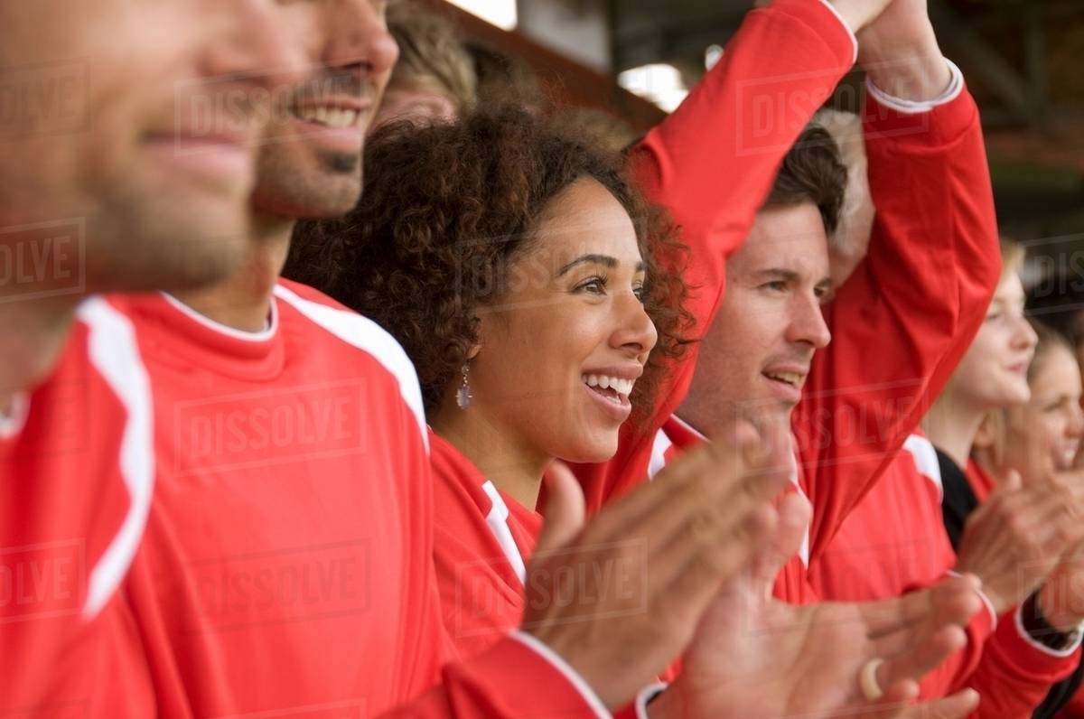 Fans clapping at football match - Royalty-free Stock Photo | Dissolve