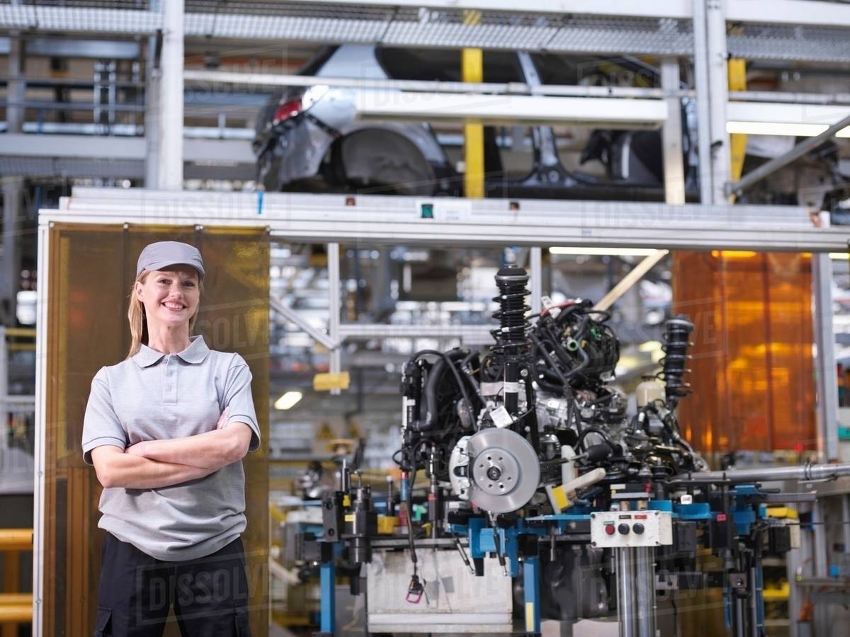 Female Car Worker With Car Parts - Stock Photo - Dissolve