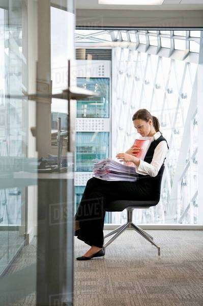 A business woman looking through files - Royalty-free Stock Photo ...