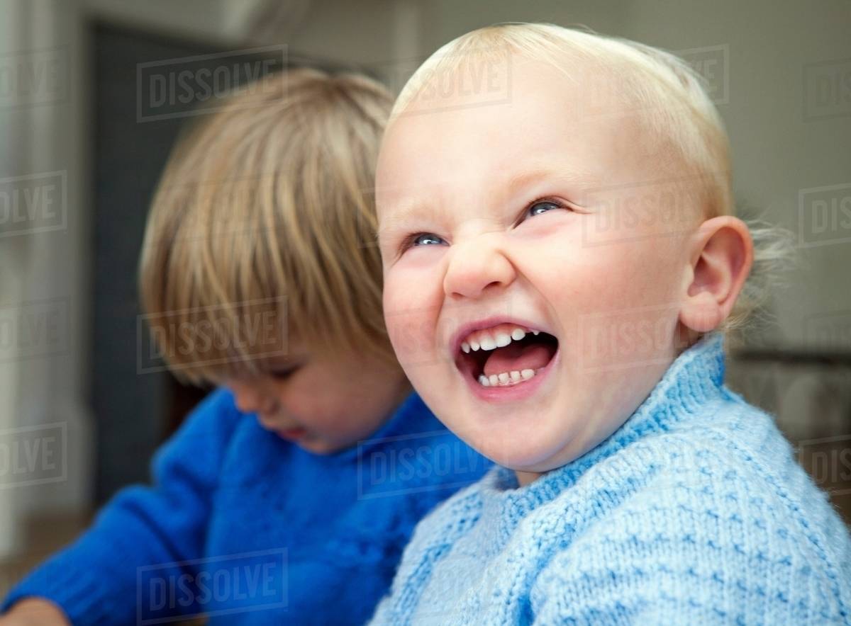 A boy toddler laughing - Stock Photo - Dissolve