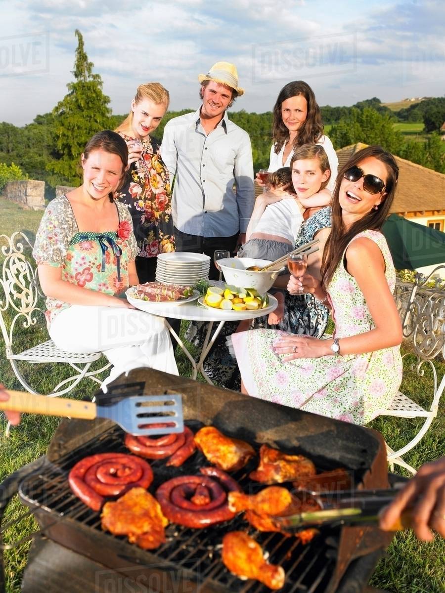 Young people having barbecue - Royalty-free Stock Photo | Dissolve