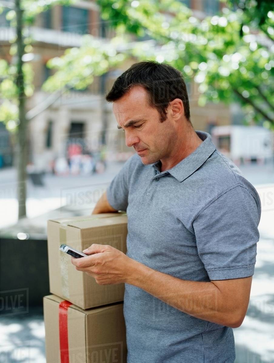 A courier delivers parcels - Royalty-free Stock Photo | Dissolve