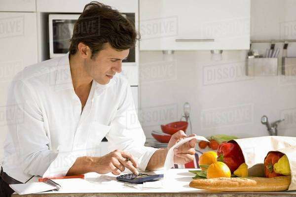 Man paying bills - Stock Photo - Dissolve