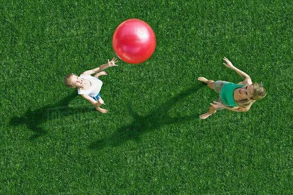 Mother and child playing ball - Stock Photo - Dissolve