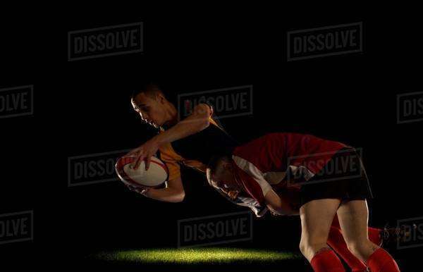 Rugby player being tackled - Royalty-free Stock Photo | Dissolve