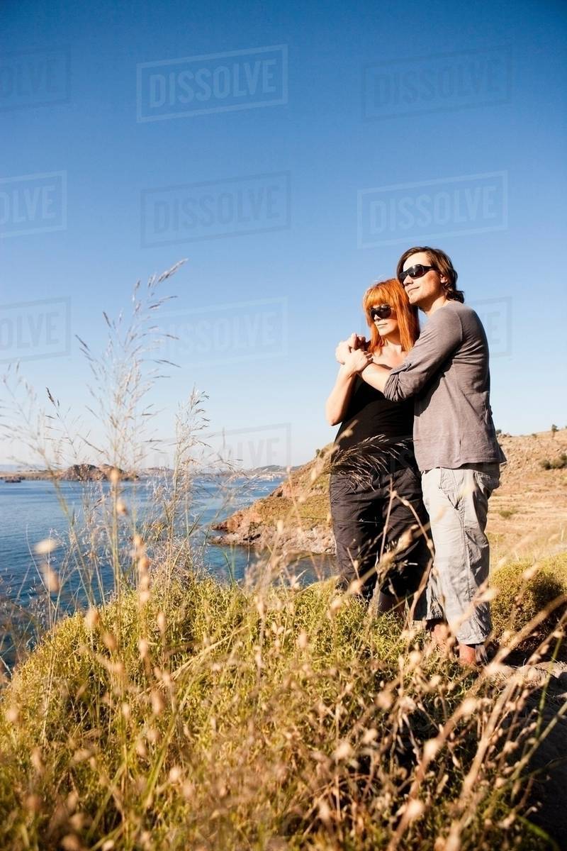 Young couple enjoying view - Stock Photo - Dissolve