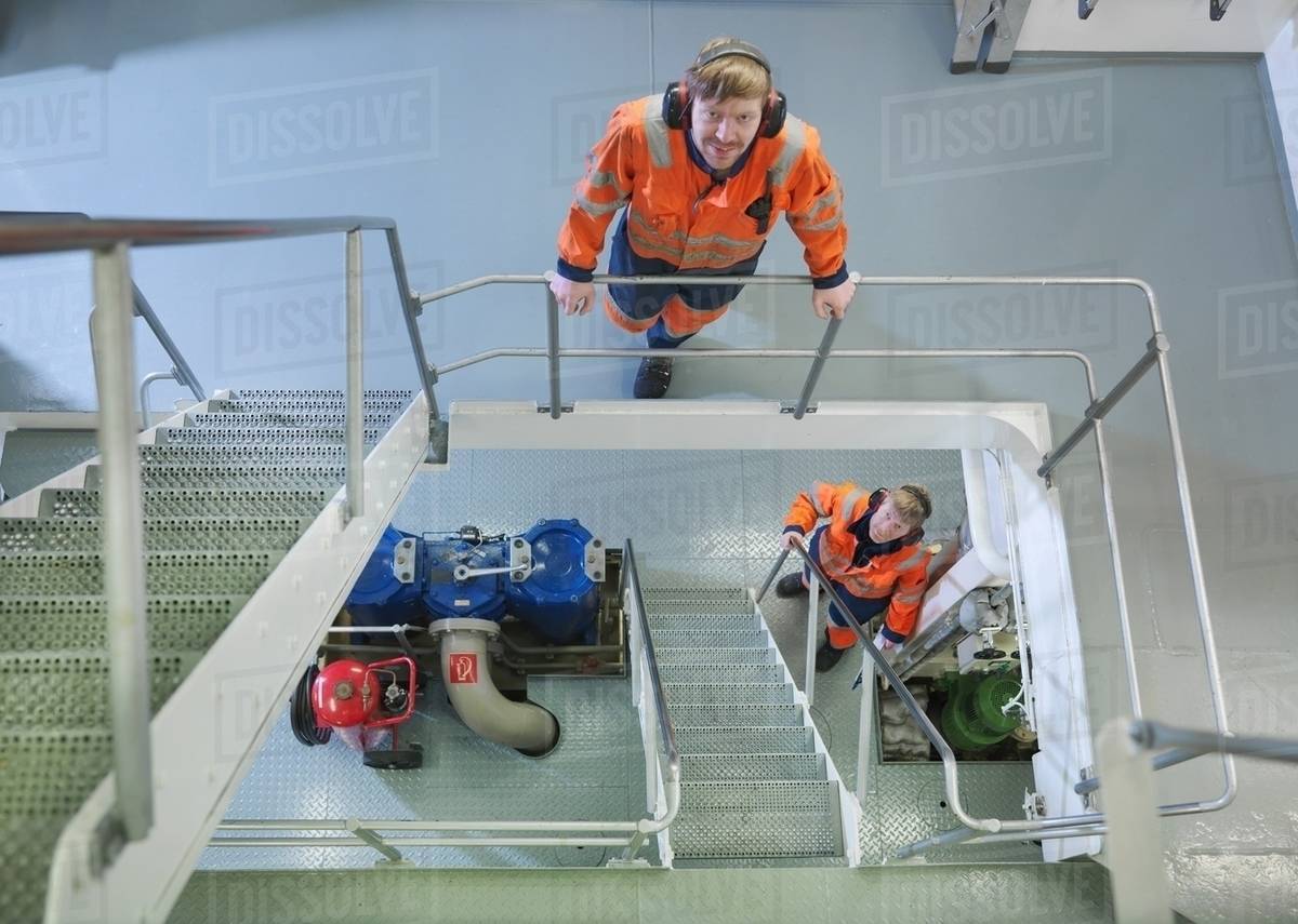 Engineers in ship's engine room - Stock Photo - Dissolve