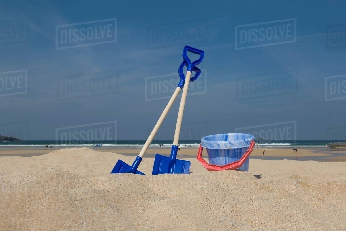 Bucket and spades by the seaside - Royalty-free Stock Photo | Dissolve