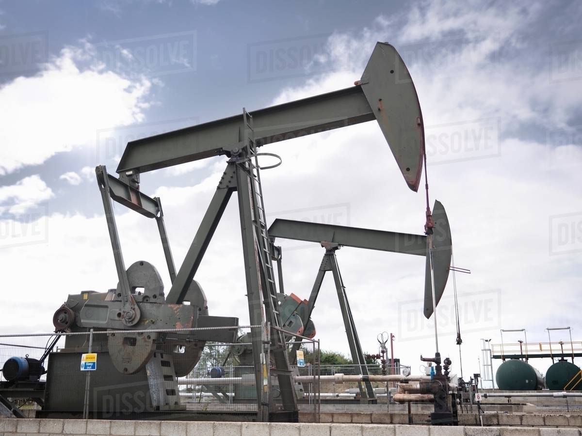Oil pumps above onshore oil wells (nodding donkeys/pumpjacks) - Stock ...