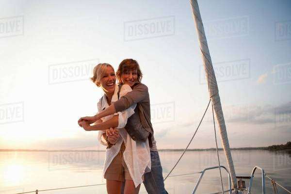Girls dancing on boat - Royalty-free Stock Photo | Dissolve