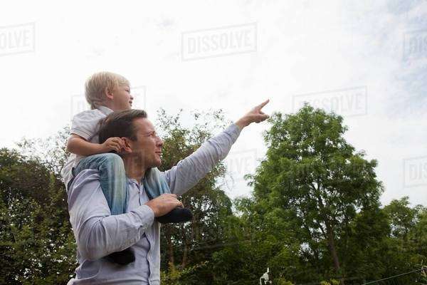 Father pointing aout at something - Royalty-free Stock Photo | Dissolve