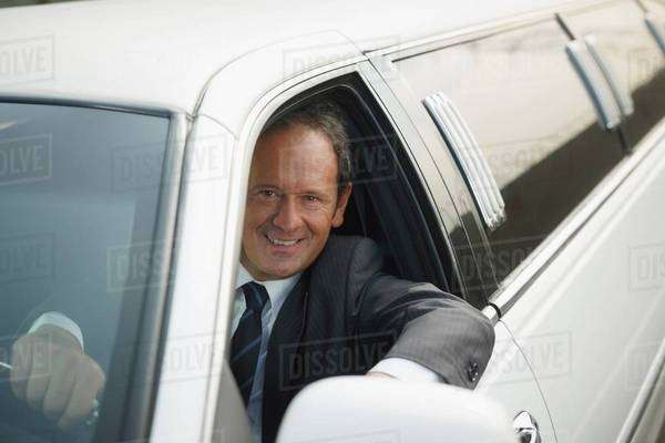 Driver in limousine - Stock Photo - Dissolve