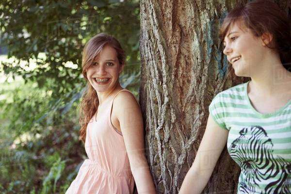 2 girls having fun together in a park - Stock Photo - Dissolve