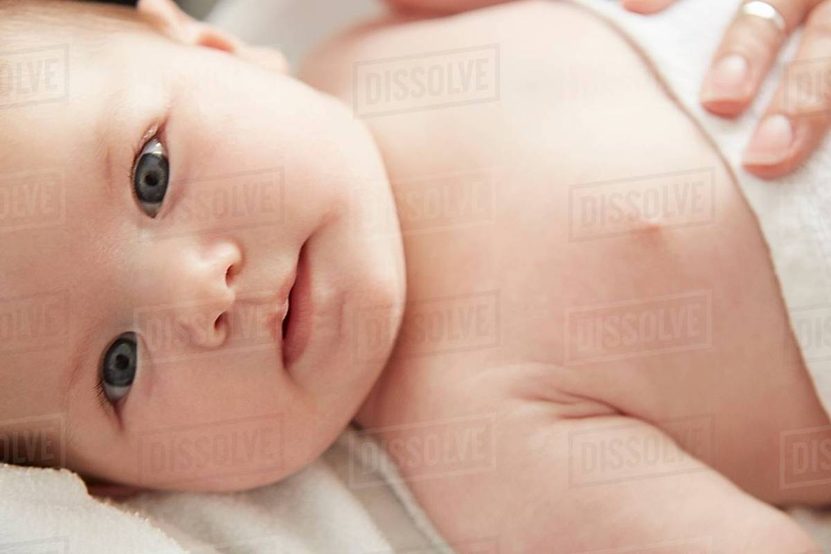 Baby looking at camera - Royalty-free Stock Photo | Dissolve