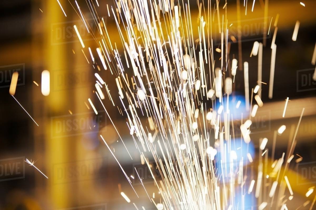 Sparks flying in factory - Royalty-free Stock Photo | Dissolve