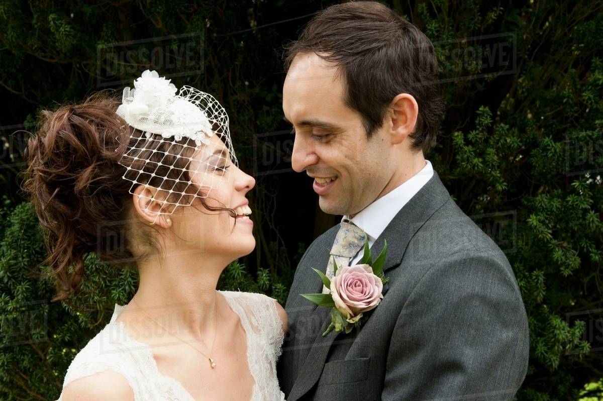 Newlywed couple smiling together - Stock Photo - Dissolve